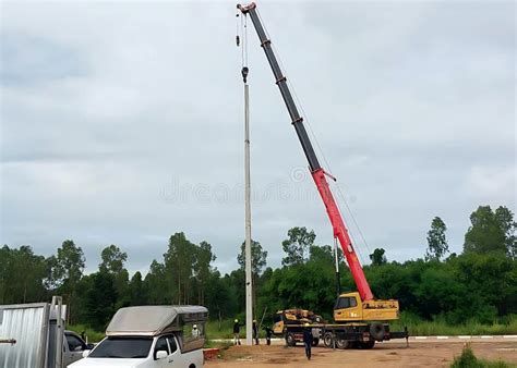 115kv Utility Pole Installation The Crane Truck Is Lifting The Electric Concrete Pole Stock