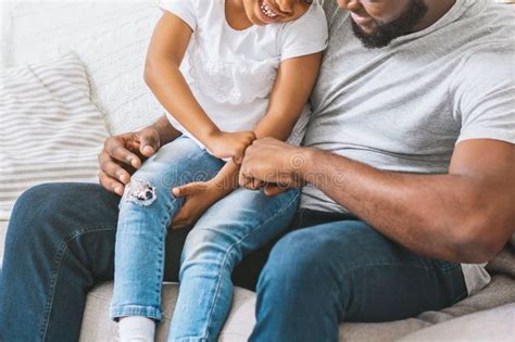 Father And Daughter Sharing A Moment On A Couch Stock Image Image Of