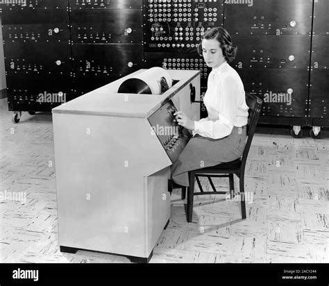 Analogue Computer Technician Preparing A Data Report Using A