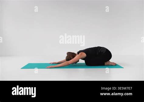 Fit Girl In Black Sportswear Performing A Sequence Of Yoga Poses