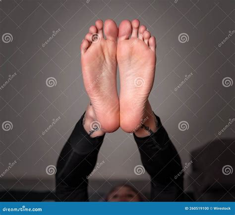 Closeup Of The Soles Of Female Feet Lying In A Bed Stock Image