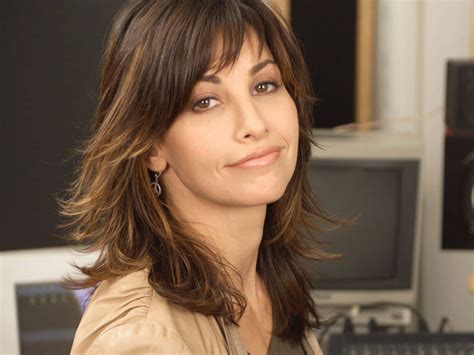 Download Actress Gina Gershon Striking A Pose Wallpaper