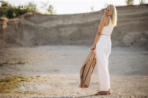 Premium Photo Young Woman In The Sand Borrow Pit