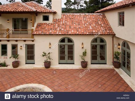 Spanish Style Luxury Home With Stucco Walls And Mexican Tile Patio
