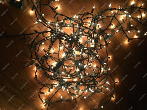 Premium Photo Close Up Of Illuminated String Lights On Table