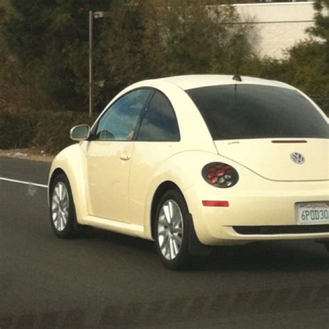 Cute Vw Bug Driving Down The Road