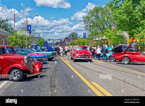 A Variety Of Restored Vintage Automobiles Lined Up Downtown Main Street