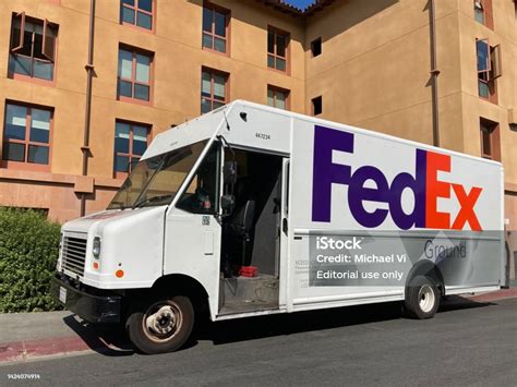 Fedex Ground Delivery Truck Parked At Residential Building Side View