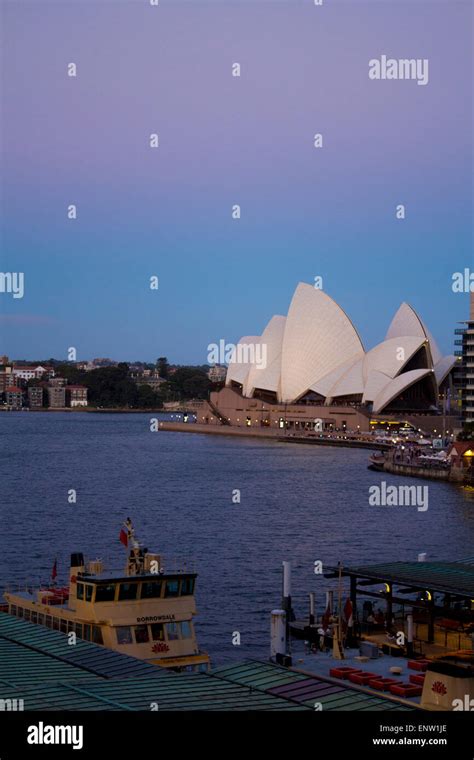 Sydney Opera House And Ferry At Circular Quay At Dusk Twilight Night