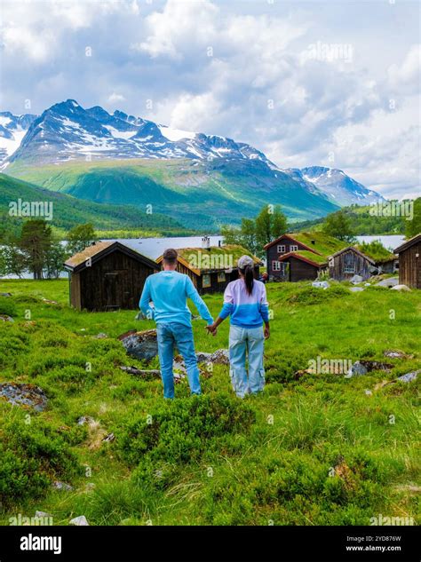 Couple Exploring Norwegian Cabins Innerdalen Norways Most Beautiful