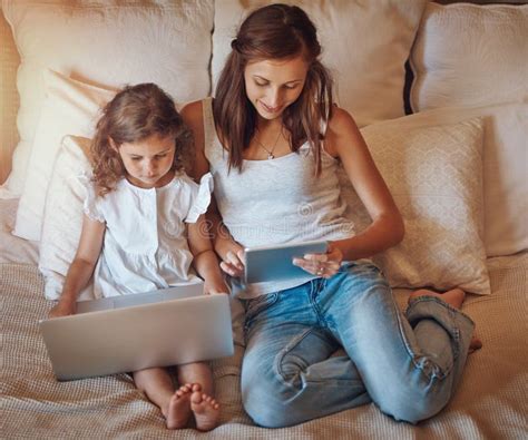 Mom Girl And Technology In Home For Streaming Movies Bonding And Top View On Bed Together