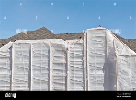 A Heated Plastic Enclosure Allows Bricks To Be Laid During The Cold