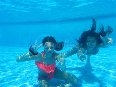 Two Girls Underwater In Swimming Pool Stock Image Image Of Motion