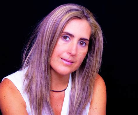 Mature Woman Shows Off Her Blonde Hair With Renewed Color After Receiving A Makeover Stock