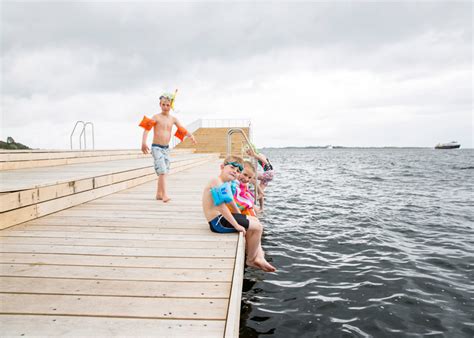 Sloped Decking Creates Waterfront Slides At Faaborg Harbour Bath