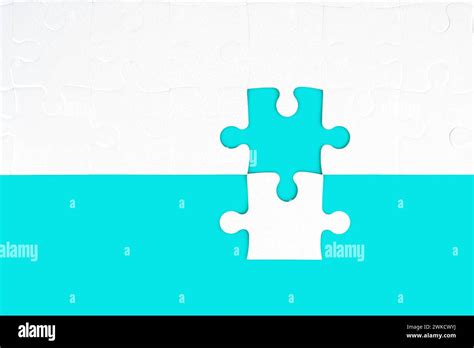 Blank Jigsaw Puzzle With The Final Piece Waiting To Be Inserted