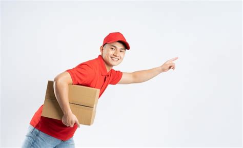 Portrait Of Asian Delivery Man On White Background Premium Photo