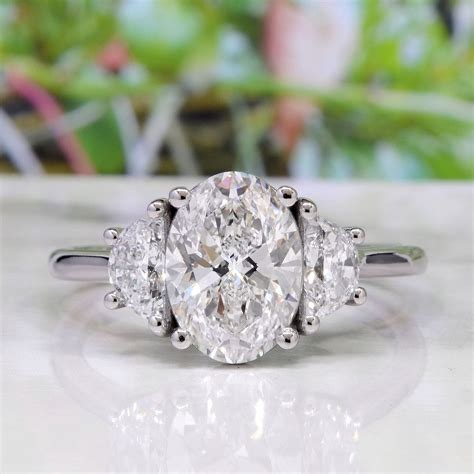 Three Stone Oval Halo Engagement Rings