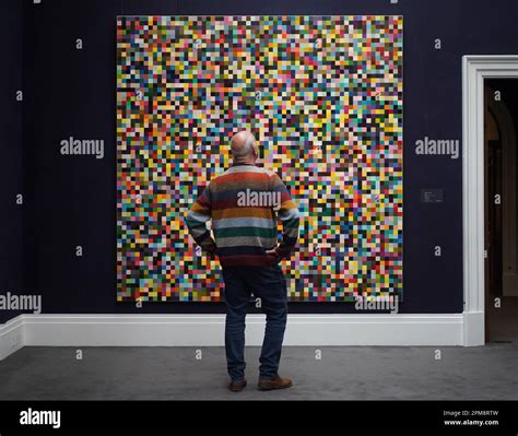 A Visitor Looking At Work By Gerhard Richter 4096 Farben 1974 With