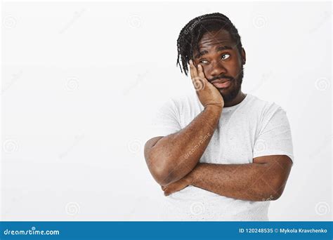 Portrait Of Unimpressed Bored Dark Skinned Man With Beard And Moustache