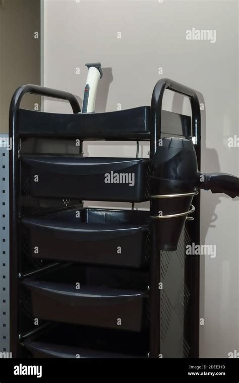Hairdresser Trolley With Tools Prepared For Work Stands In A Beauty