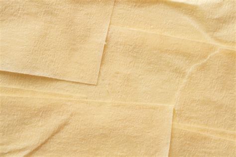 노란색 접착 종이 테이프 질감 배경 프리미엄 사진