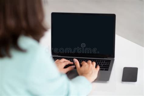 Millennial Caucasian Lady Typing On Computer With Blank Screen At