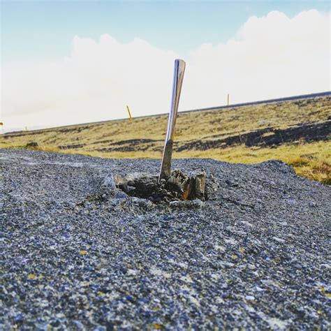 Premium Photo Table Knife Stuck In Rock Against Sky
