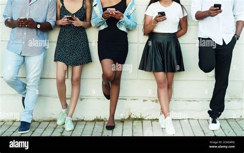 Group Of Friends Watching Smart Mobile Phones Group Of Multicultural