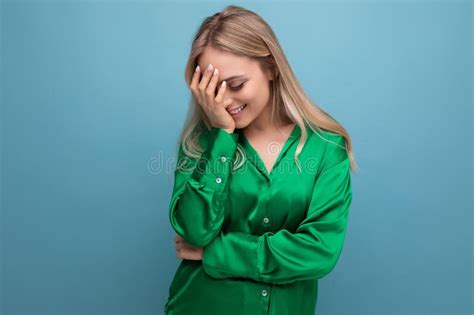 Cute Charming Young Adult Woman Upset Holding Hand Near Face On Blue