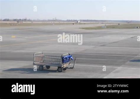 Empty Baggage Cart In The Aiport Tracktor With Emty Baggage Carts