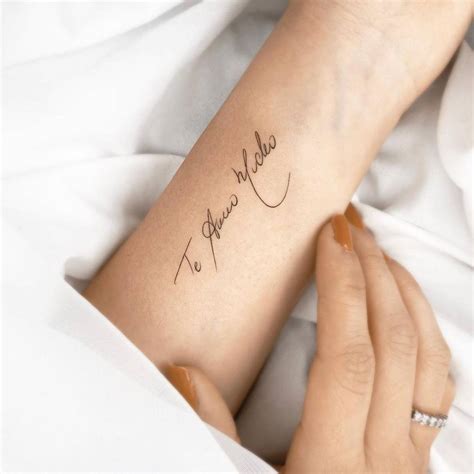 Te Amo Mucho Lettering Tattoo On The Inner Forearm