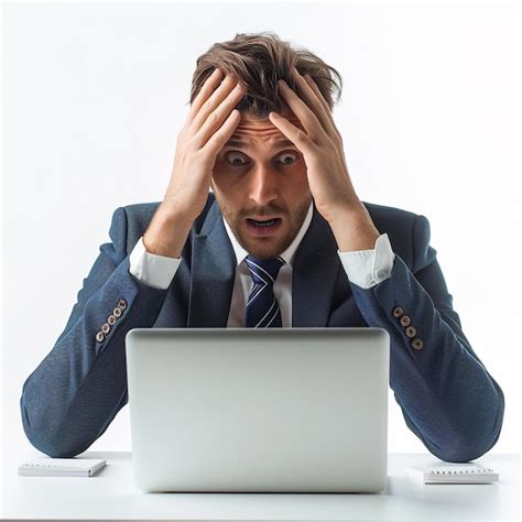 A Man In A Suit With A Laptop In Front Of Him Premium Ai Generated Image