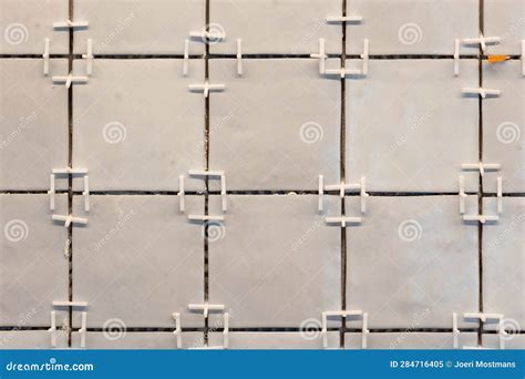 A Front Portrait Of A Tile Wall Under Construction The Wall Is Being