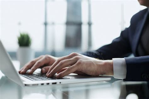 Closeup Image Of A Man Working And Typing On Laptop Computer Keyboard