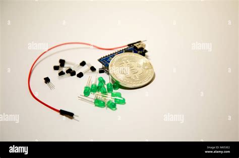 Arduino Bitcoin And Around Transistors Lined Up On A White Background
