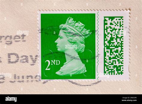 Green 2nd Class Stamp With Queen Elizabeth Ii Head Stuck On Envelope