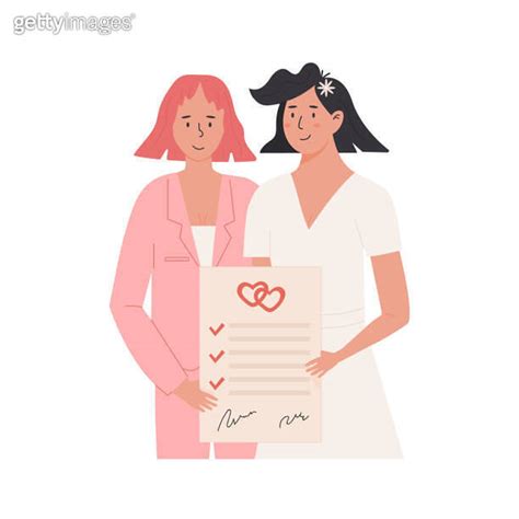A Cute Female Couple Holding Signed Marriage Certificate Married