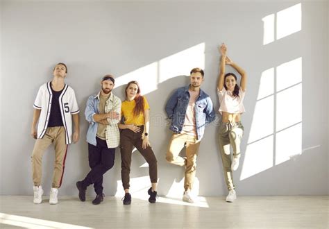 Group Of Young Male And Female Models Wearing Casual Clothes Posing In