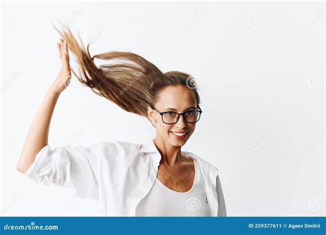 Woman Portrait With Tanned Skin And Long Natural Flowing Hair Posing On