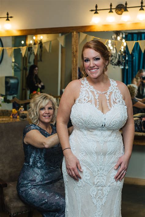 Mother Of Bride Helping Bride Get Into Wedding Dress Arizona Photographer Chris Frailey