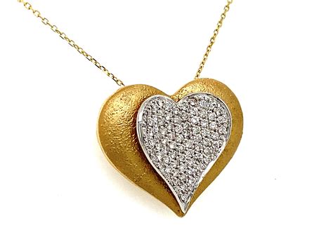 14k Puff Heart Pendant With Pave Set Diamond Center And Puff Satin Finish