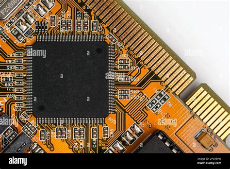 Orange Printed Circuit Board With Black Chip Space For Text In Middle View From Above Stock