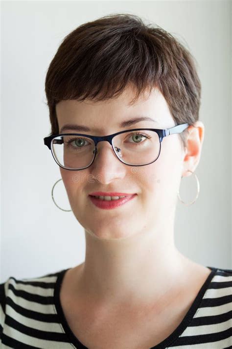 A Beautiful Short Haired Brunette Looks Straight With A Smile Stock