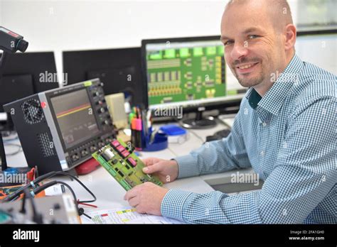 Engineer At The Workplace Assembly And Development Of Electronics In