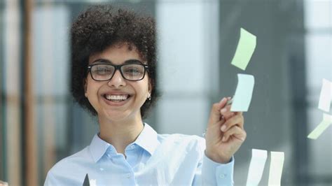 Premium Photo A Girl In A Modern Office Behind Glass Uses Sticky