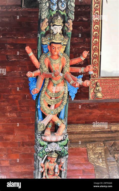 Colourful Wood Carving Of A Multi Armed Deity In Traditional Nepalese
