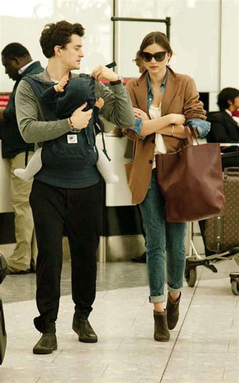 Miranda Kerr And Orlando Bloom With Son Flynn At Heathrow International Airport In London