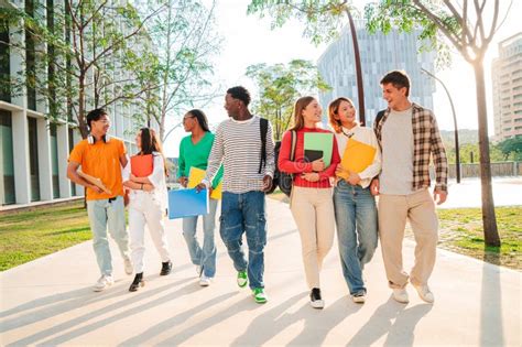 Big Group Of Multiracial Students Walking Together At University Campus