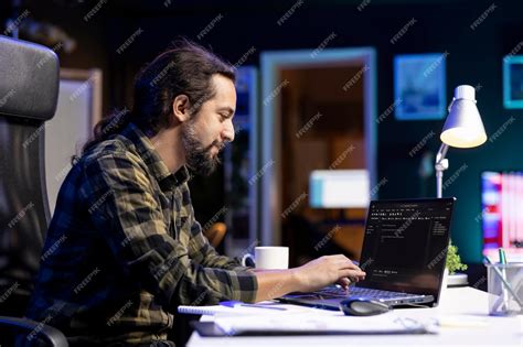 Free Photo Male Programmer Coding On Laptop